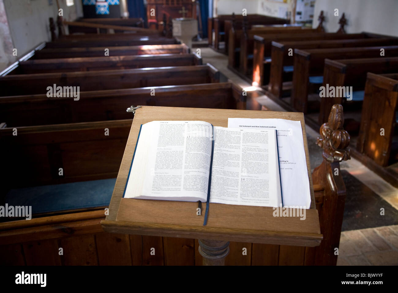 Open bible book on lectern in small empty church All Saints and St ...