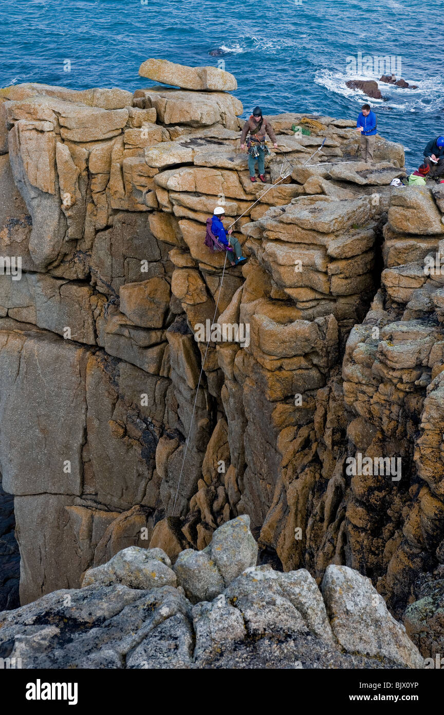Climbers on the rocks at Mayon Cliff Stock Photo - Alamy
