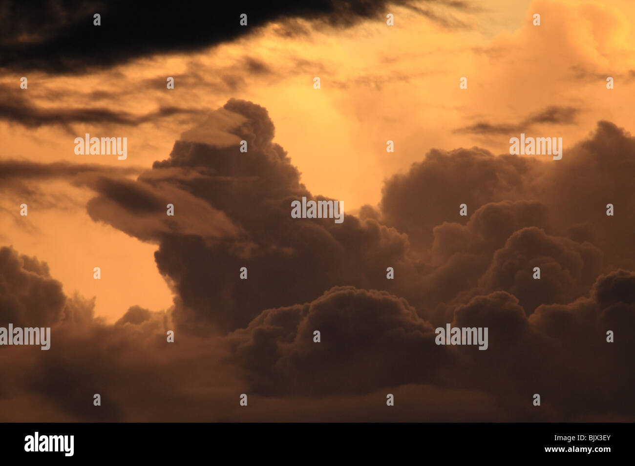 Dramatic Light shines through storm clouds Stock Photo - Alamy