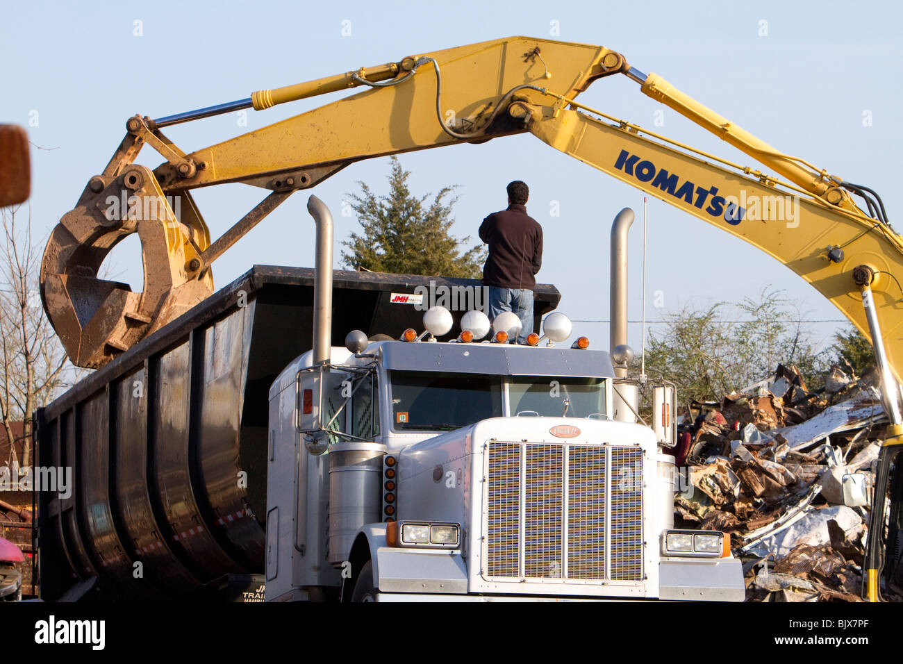 Loading a large truck lorry at a junkyard with scrap metal Stock Photo ...