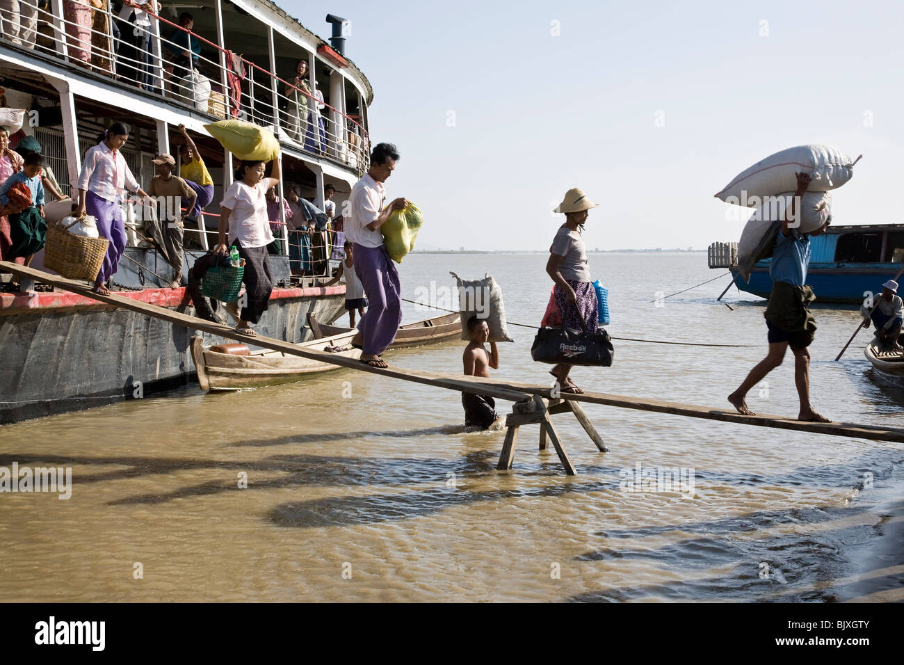 Passengers landing at Pakokku village. Ayeyarwady river. Stopover on ...