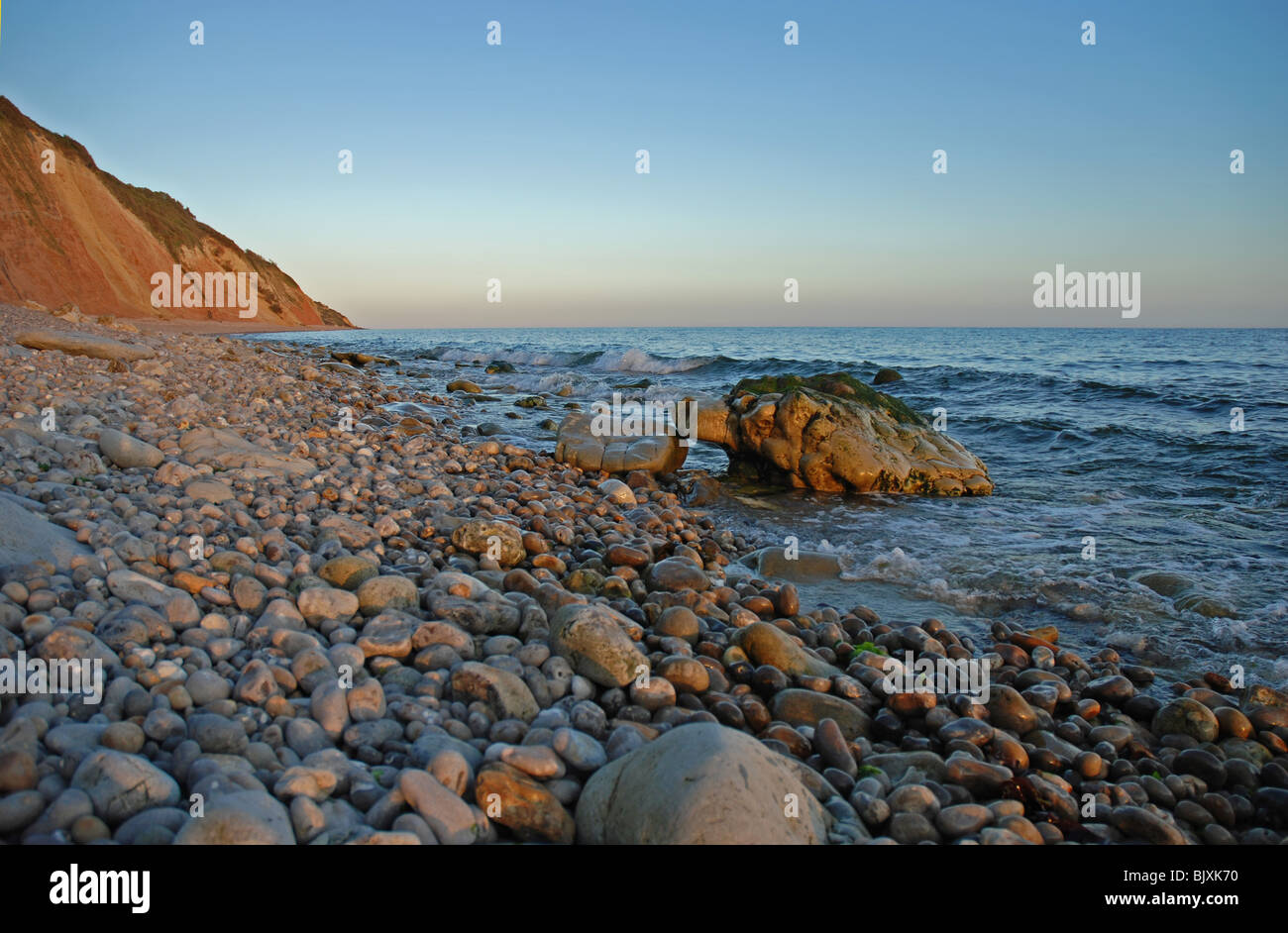 Pebbles, Shingle beach and sandstone cliffs, Seaton Beach, East side of ...