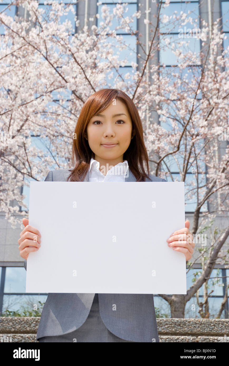 Young woman holding blank placard Stock Photo - Alamy Young woman holding blank placard Stock Photo - Alamy