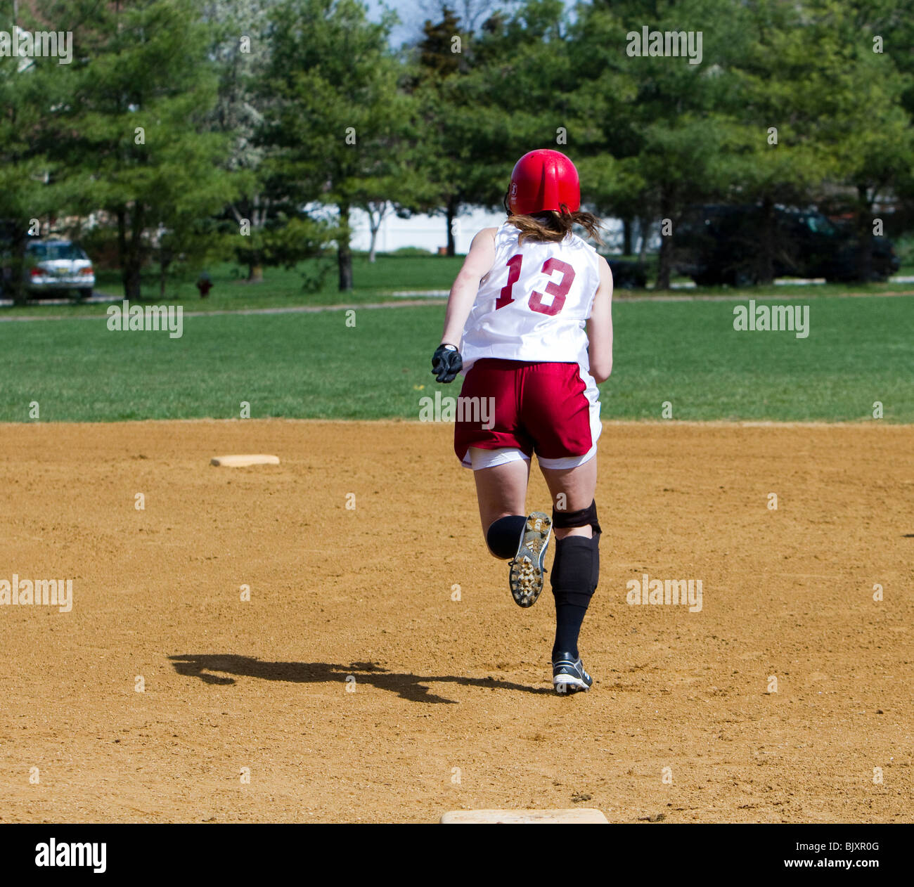 Girls high school softball game Stock Photo - Alamy