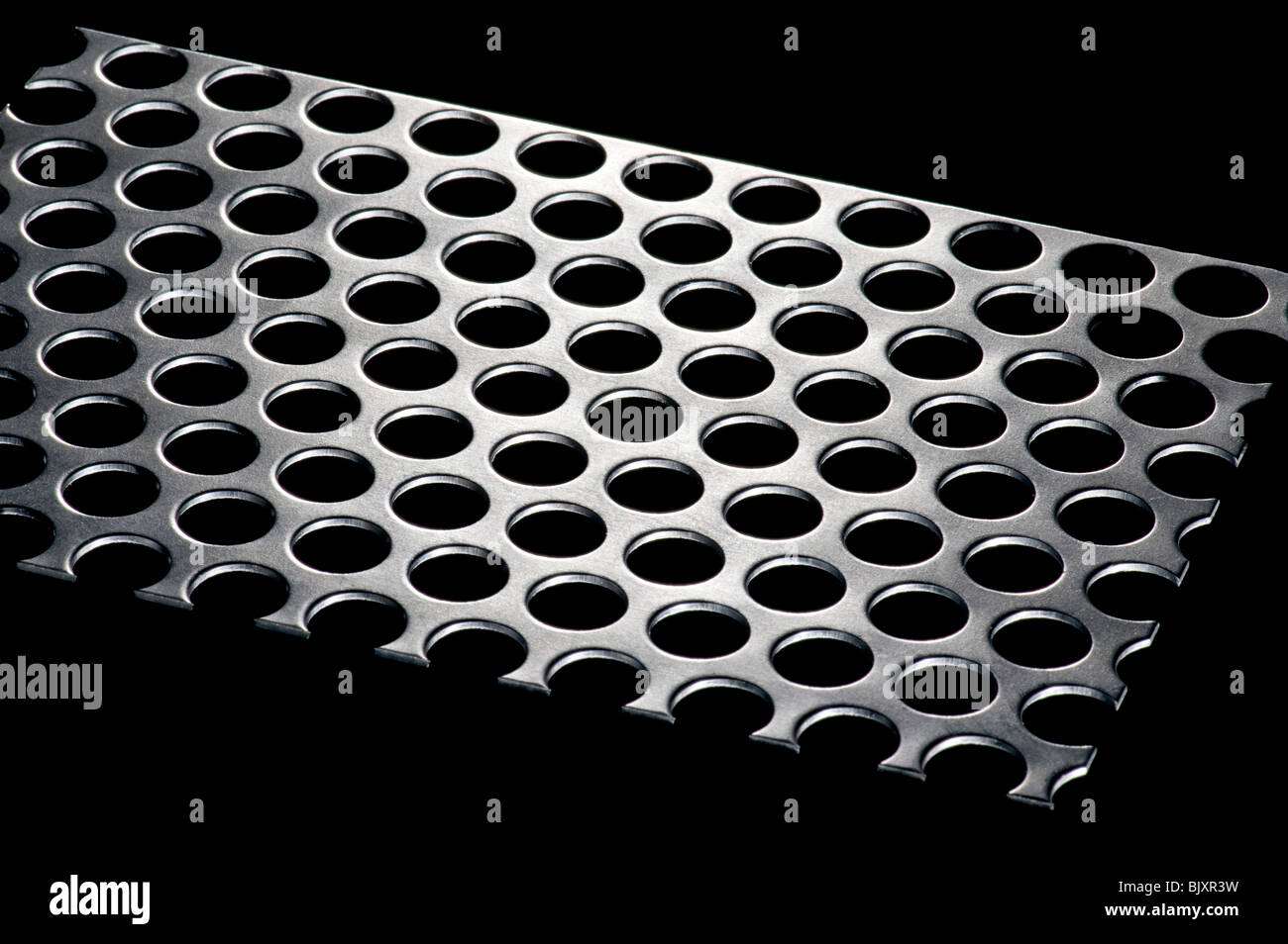 object on black - tool steel punched metal Stock Photo - Alamy