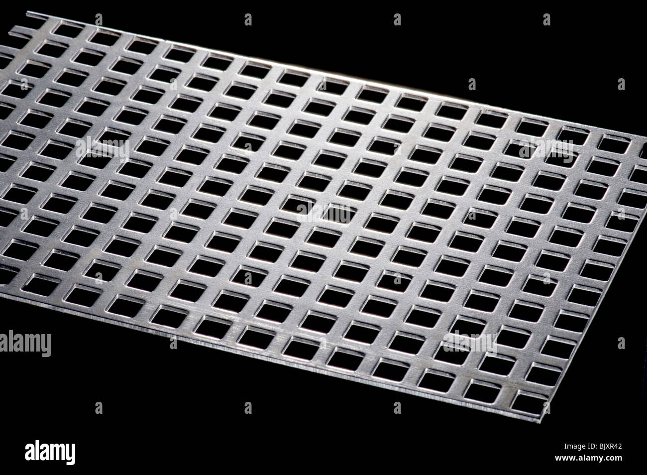 object on black - tool steel punched metal Stock Photo - Alamy