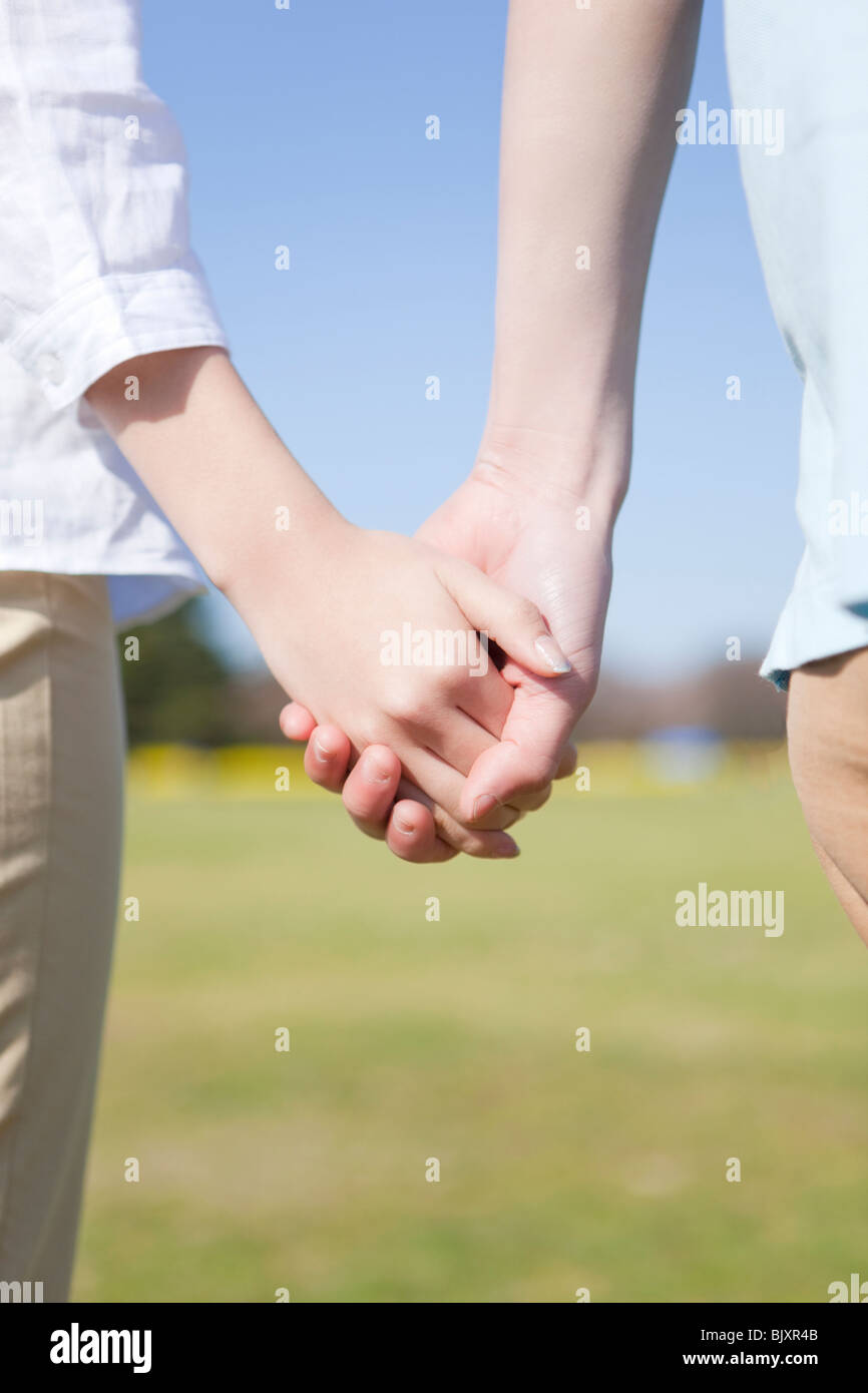 Hands of young couple Stock Photo - Alamy