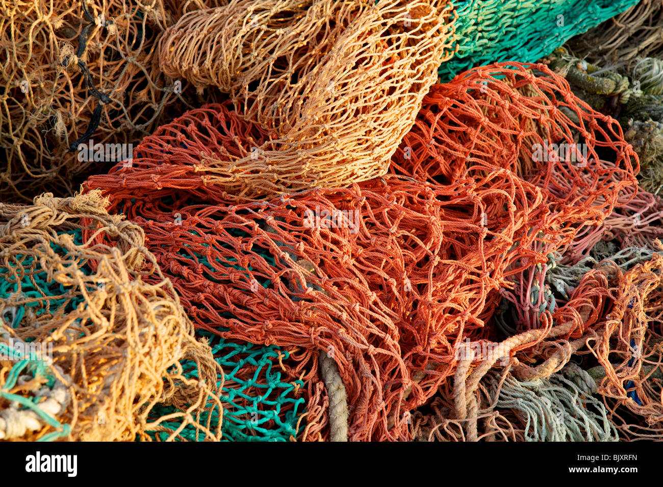 tangled fishing nets lying near fishing tender Stock Photo - Alamy