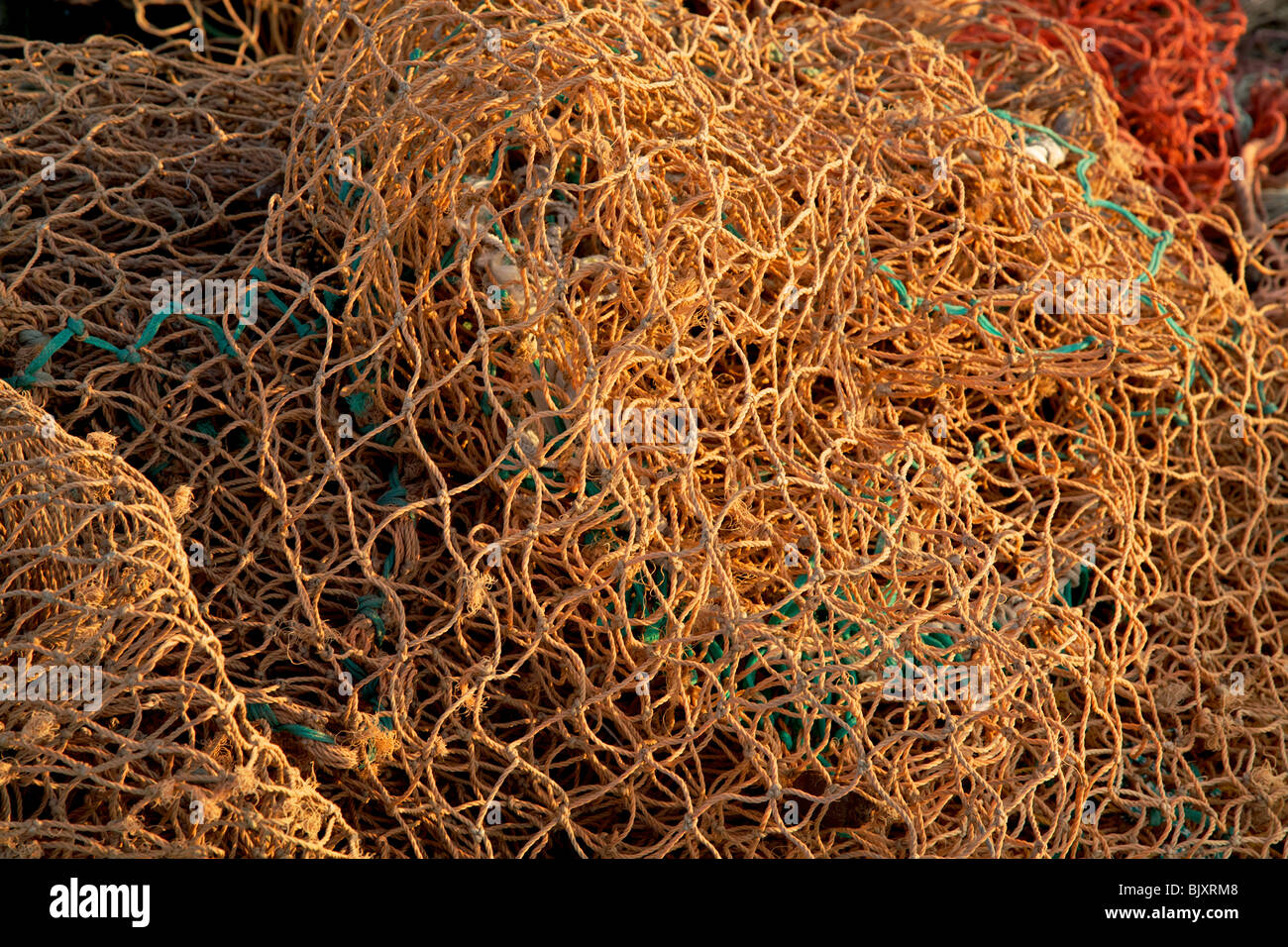 tangled fishing nets lying near fishing tender Stock Photo - Alamy