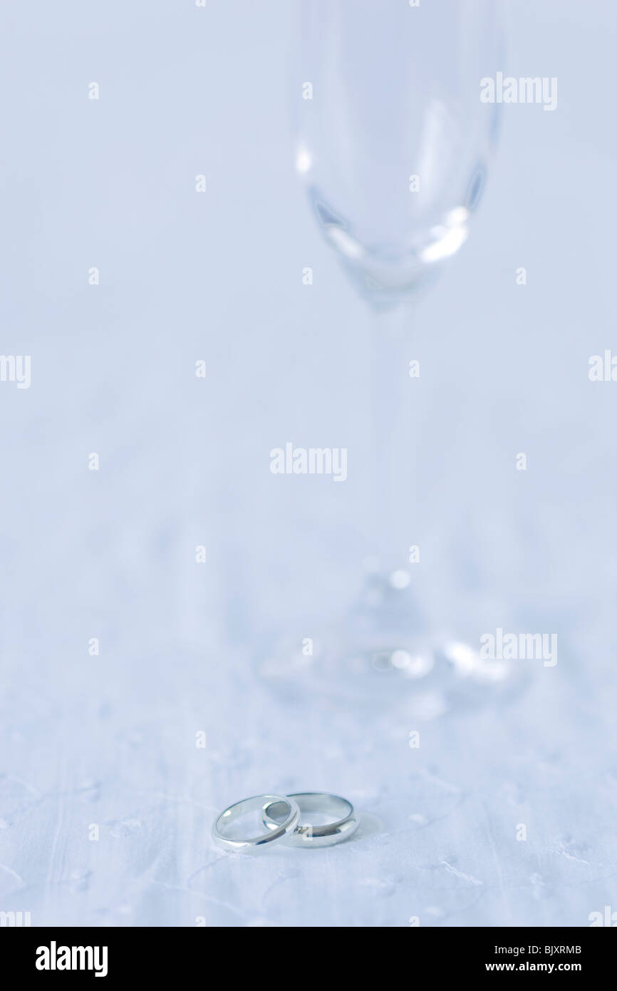 Wedding rings and glass Stock Photo - Alamy
