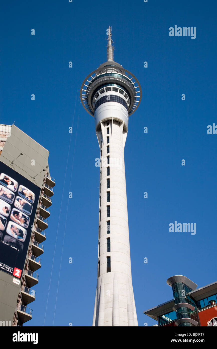 Sky Tower observation and radio tower by skyscraper buildings in city ...