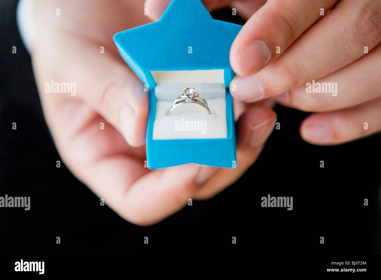 Young man showing a ring Stock Photo - Alamy