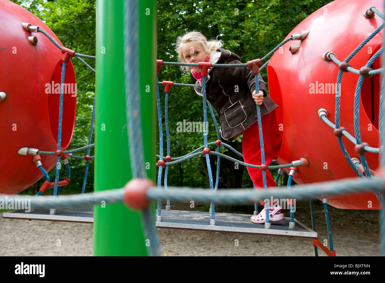 climbing and playing little girl at the playground Stock Photo - Alamy
