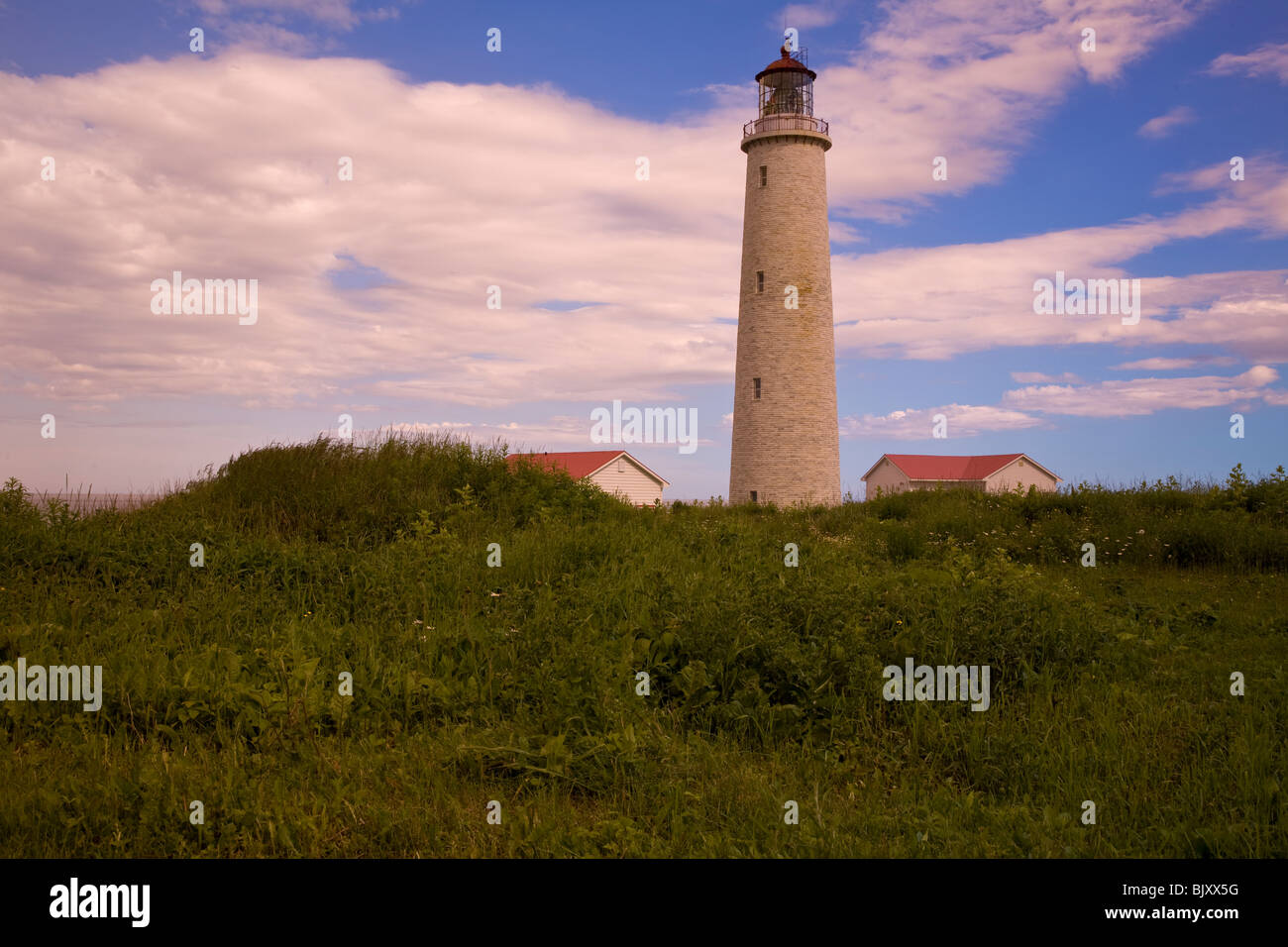 A stately stone lighthouse stands atop Cap-des-Rosiers Forillon ...