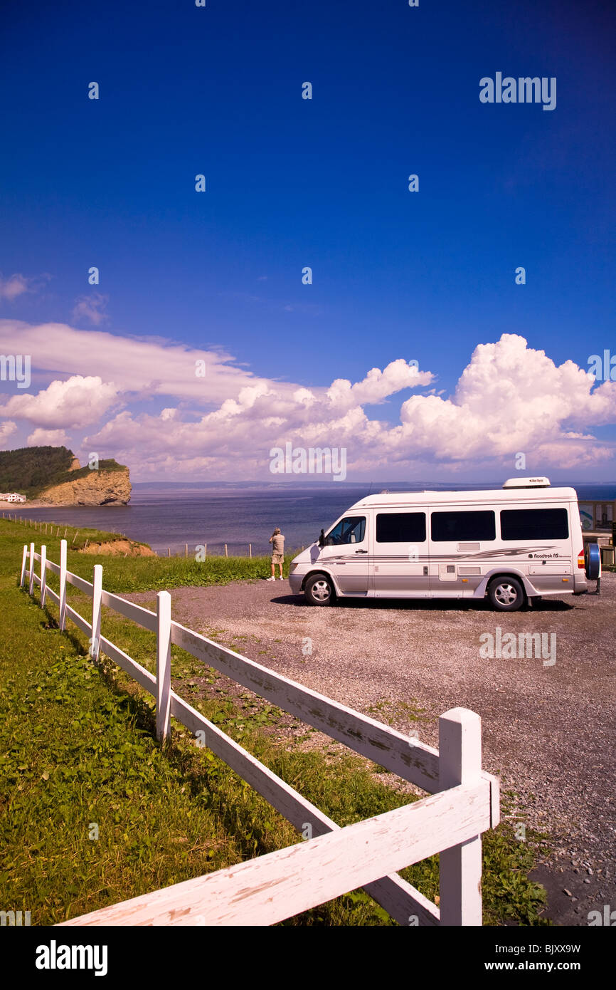 Photograph of a white recreational vehicle or rv parked in a scenic ...