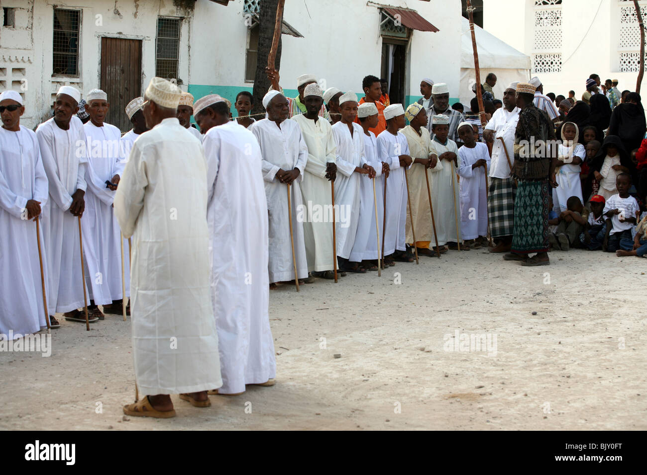 Men perform the stick dance Kirumbizi during maulidi outside Riyadha ...