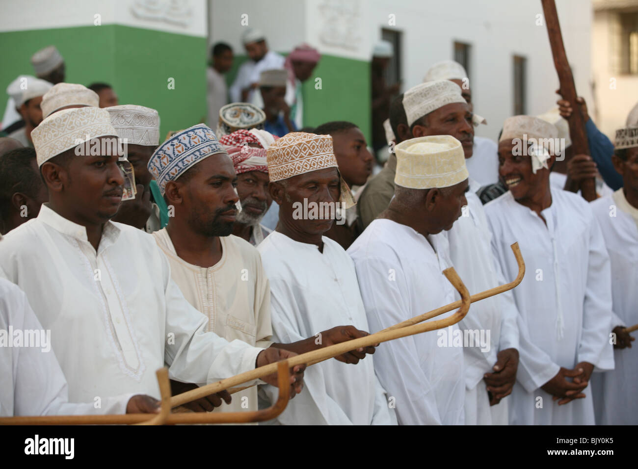 Men perform the Stick dance Kirumbizi during maulidi outside Riyadha ...