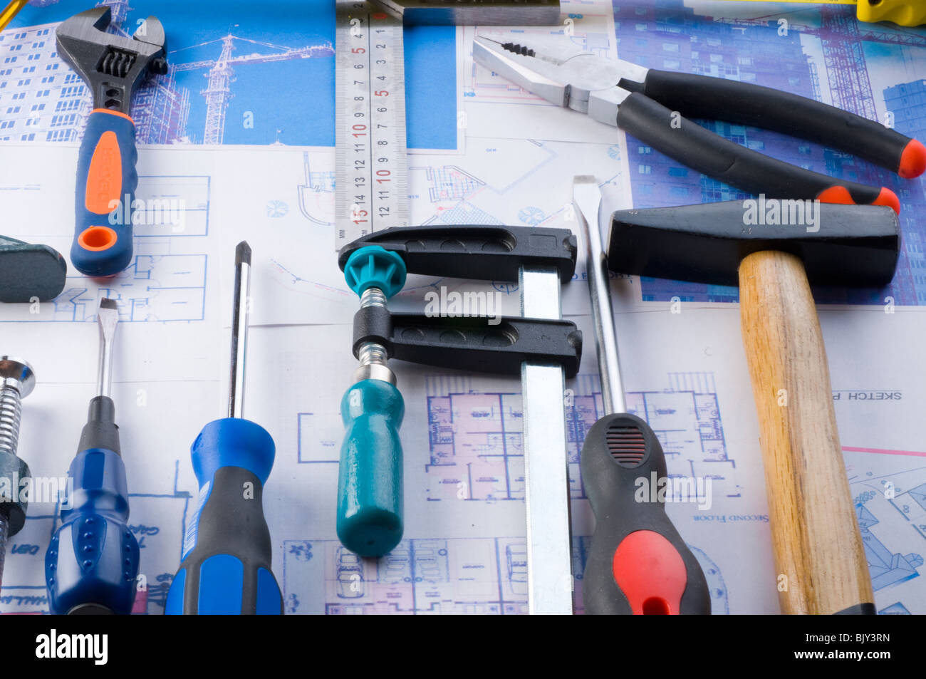Working tools on a background of drawings Stock Photo - Alamy