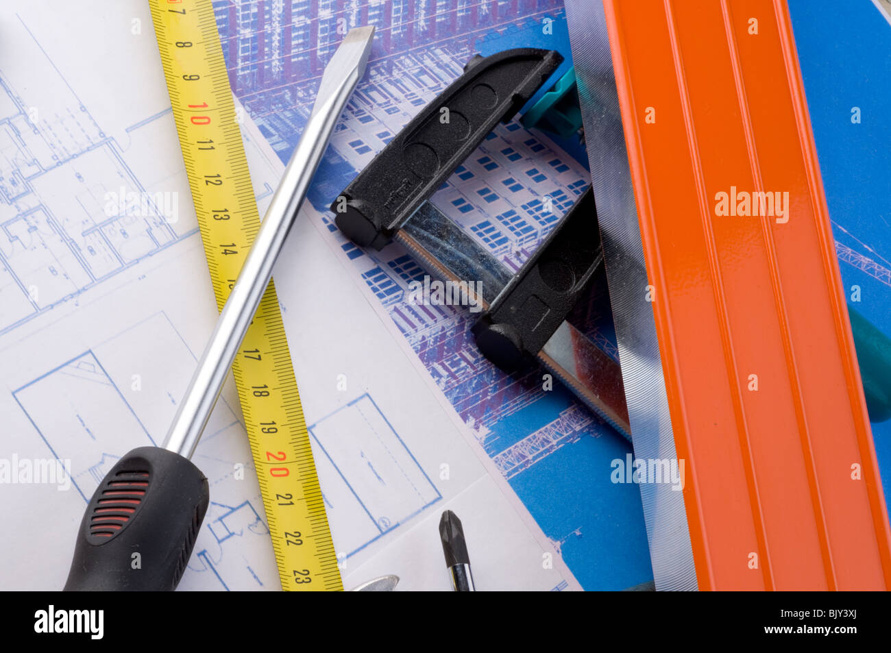 Working tools on a background of drawings Stock Photo - Alamy