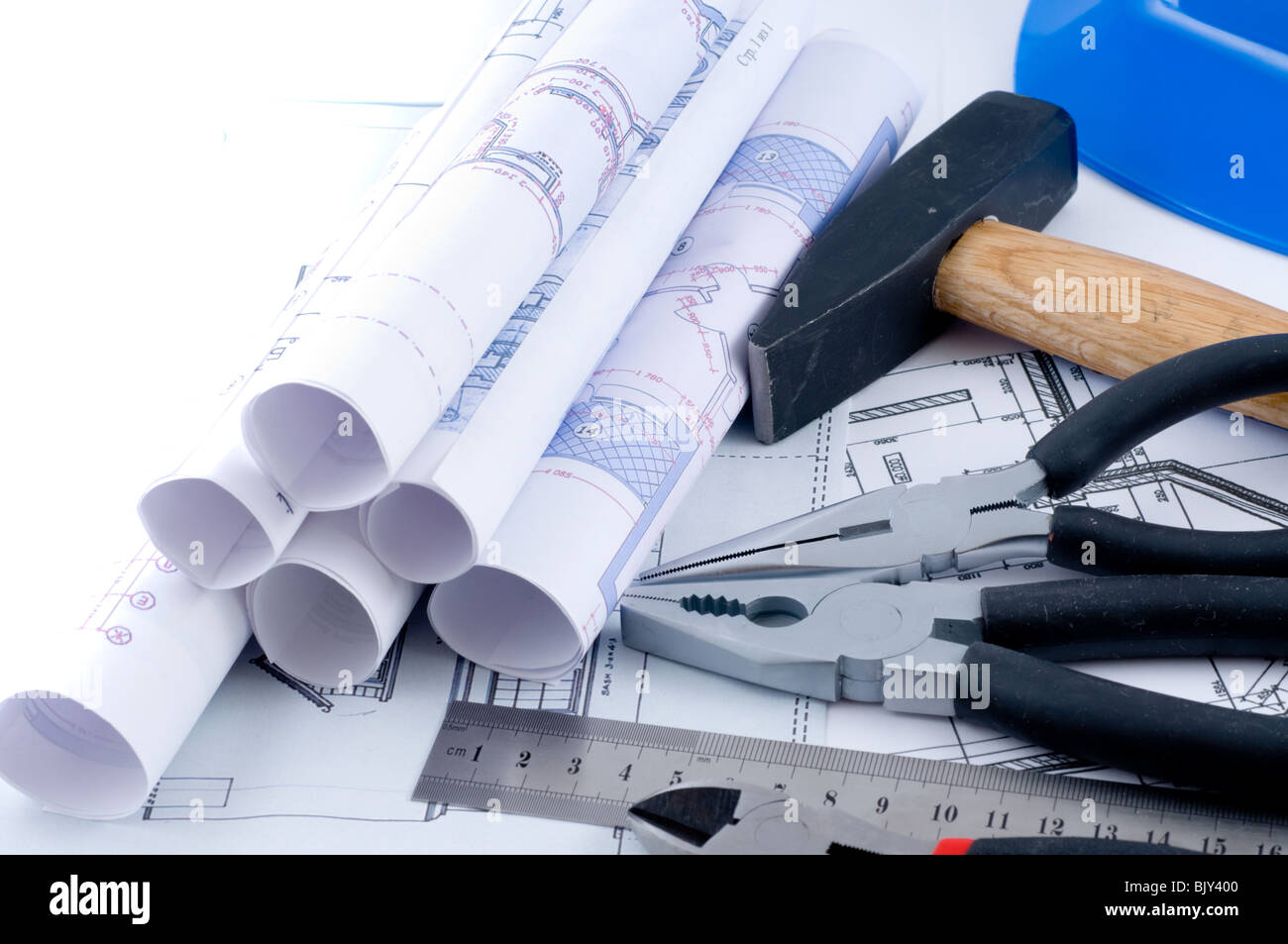 Working tools on a background of drawings Stock Photo - Alamy