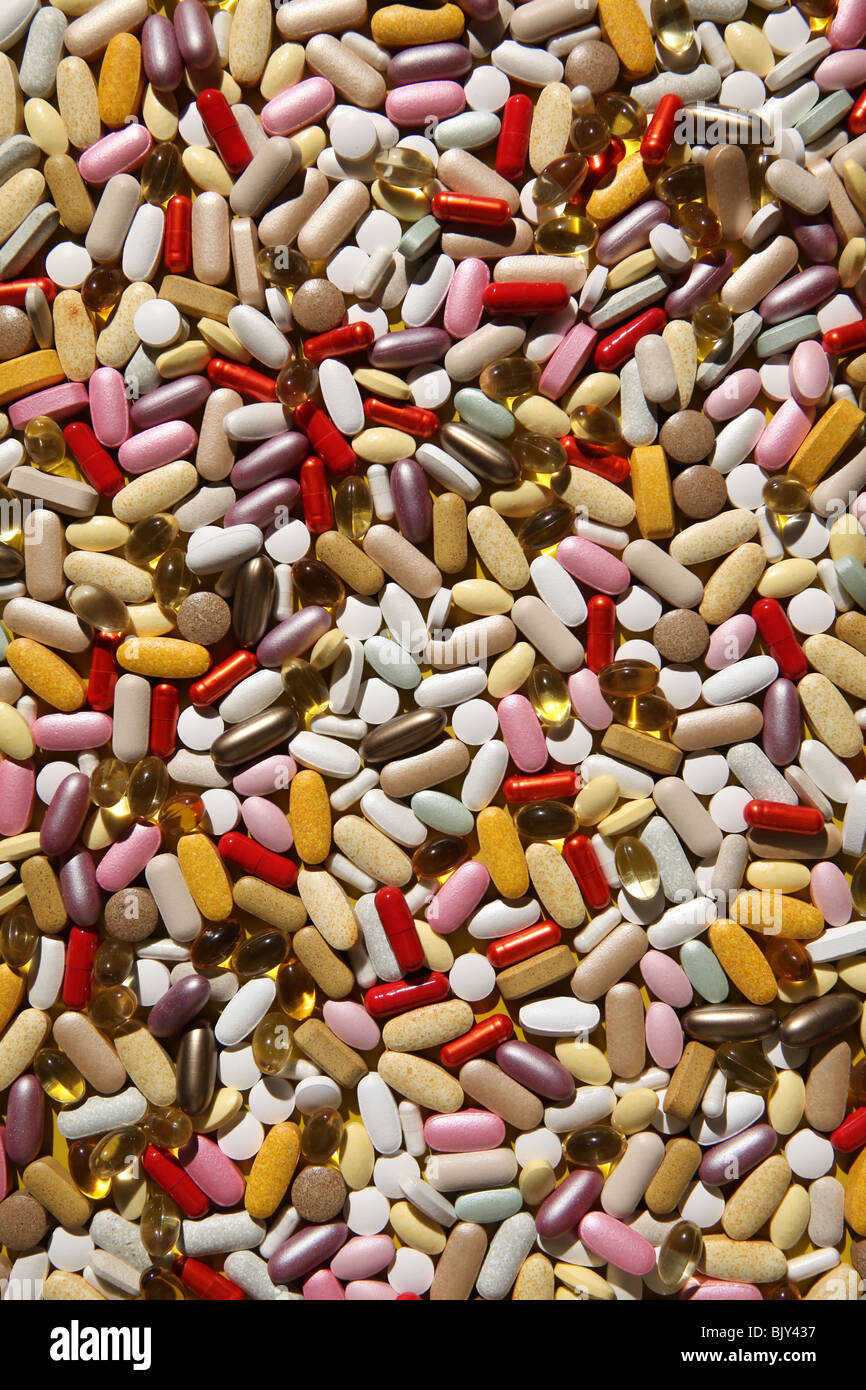 A background of colorful capsules, tablets and pills Stock Photo - Alamy