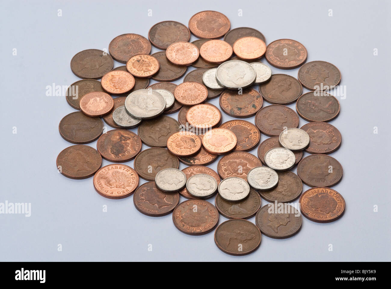 Coins in shape of face Stock Photo - Alamy