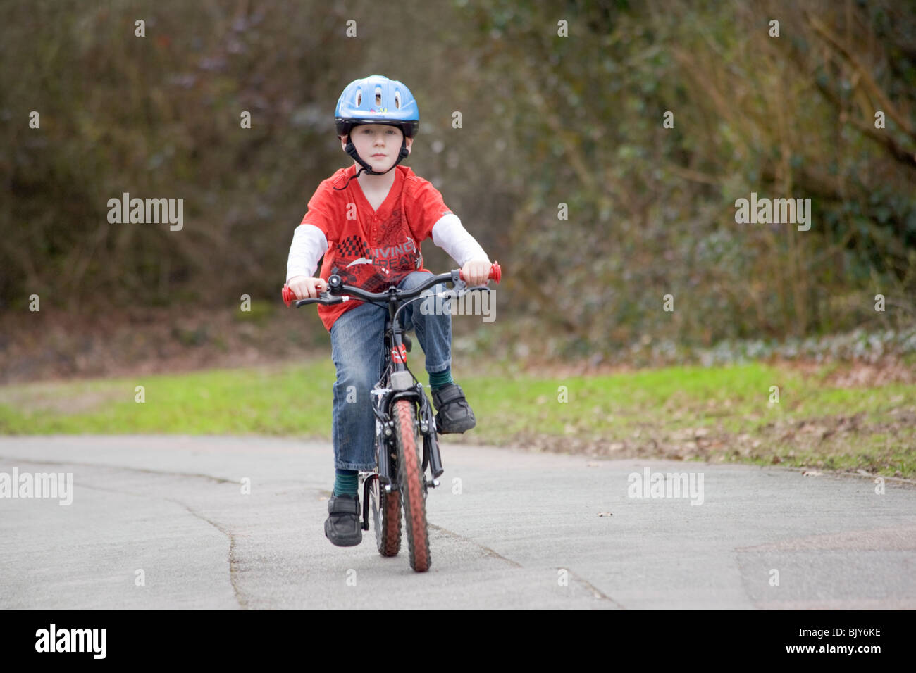 Boy riding a bike Stock Photo - Alamy