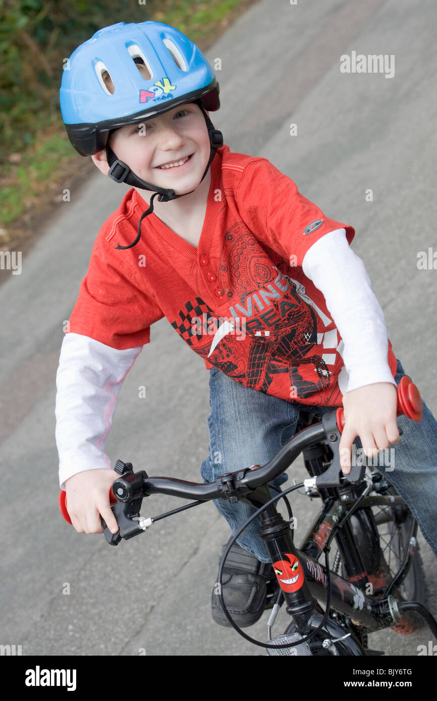 Boy riding a bike Stock Photo - Alamy