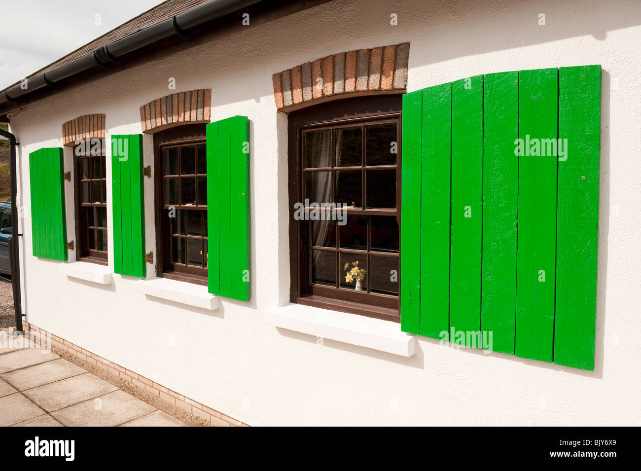 Traditional green wooden shutters on windows of house Stock Photo - Alamy