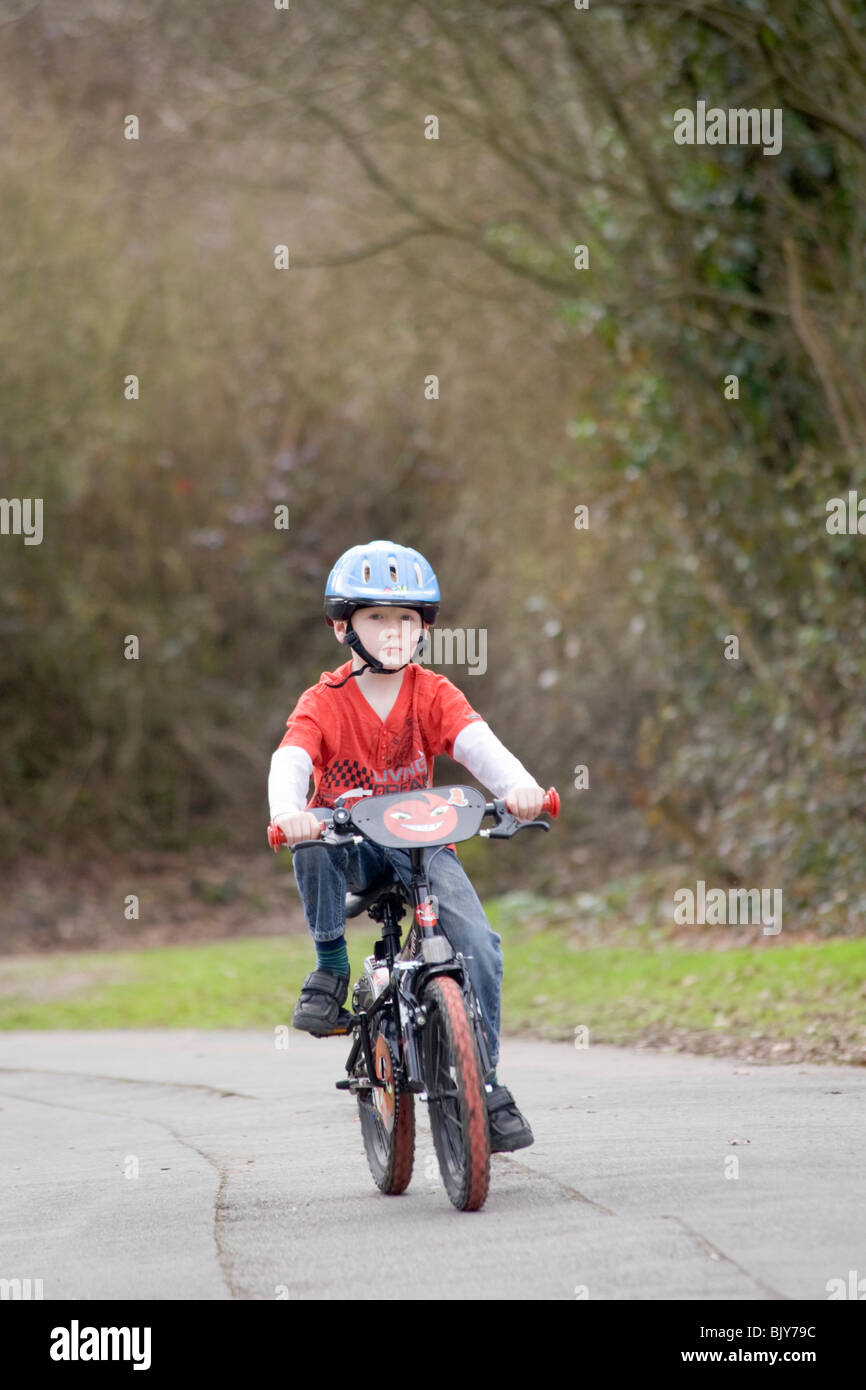 Boy riding a bike Stock Photo - Alamy