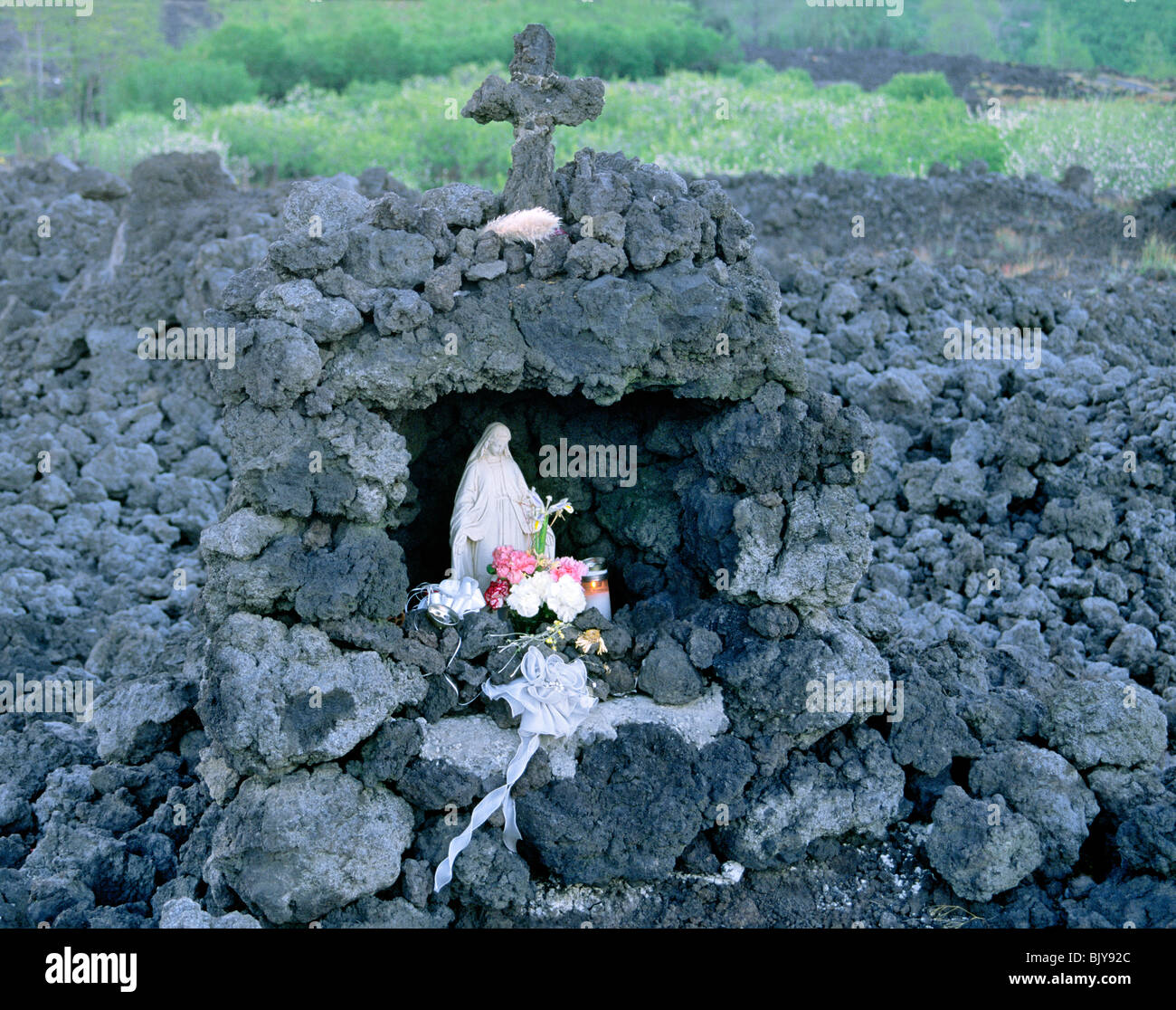 Sicily, Italy. Roman Catholic Christian shrine on ash lava pumice slope ...