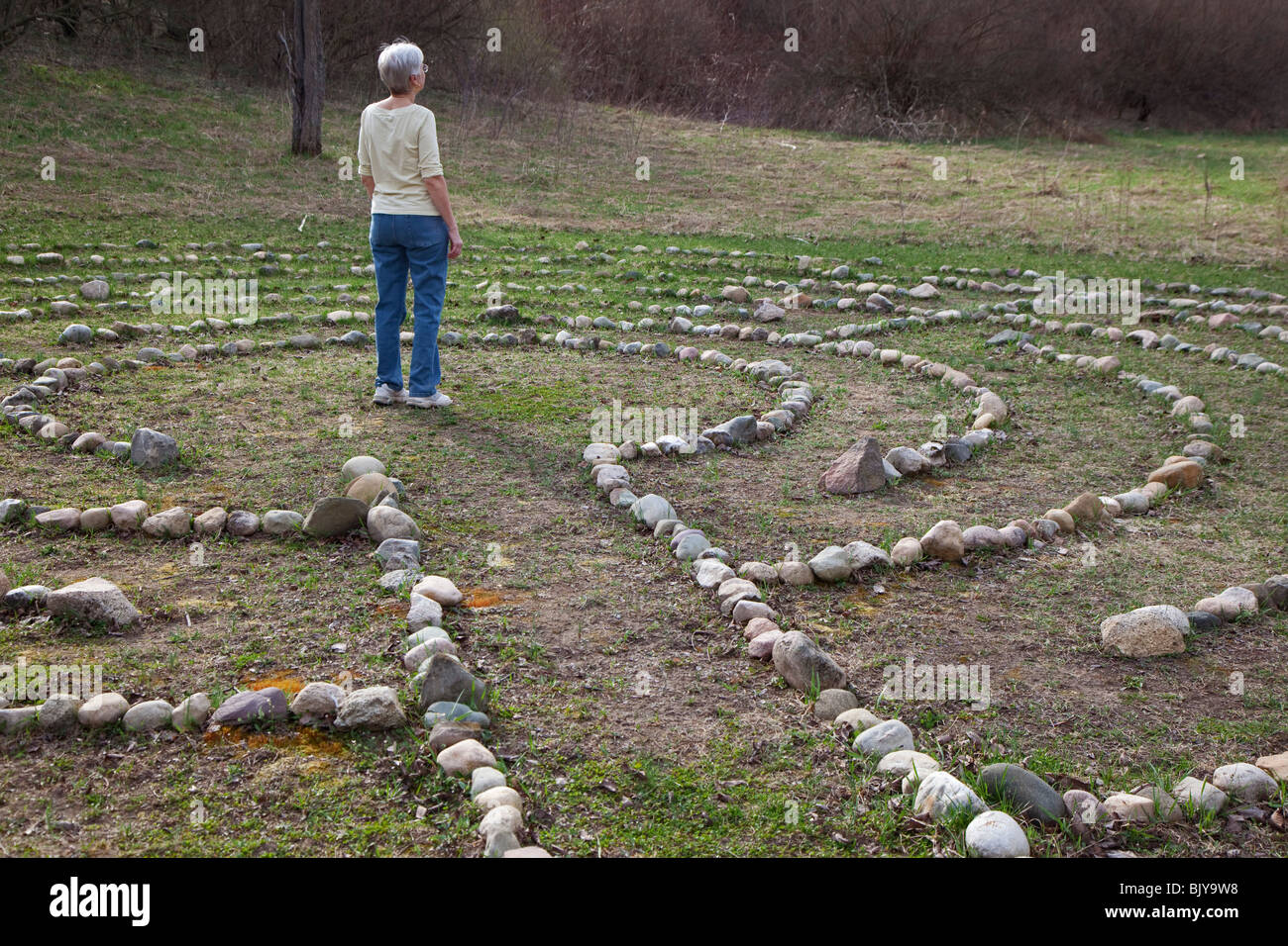 Woman in Meditation Labyrinth Stock Photo - Alamy