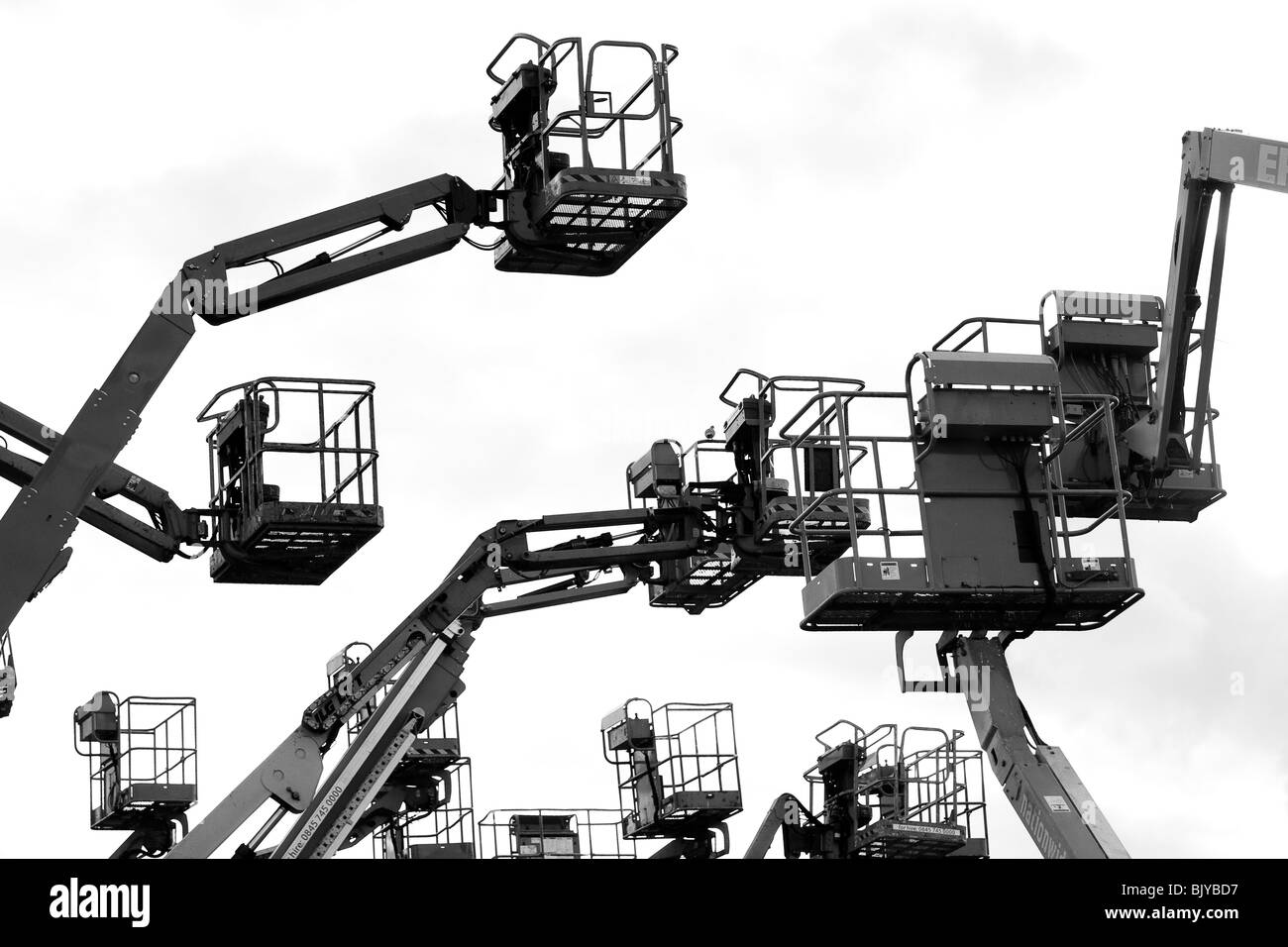 Black and white silhouette of cherry pickers, cranes Stock Photo - Alamy