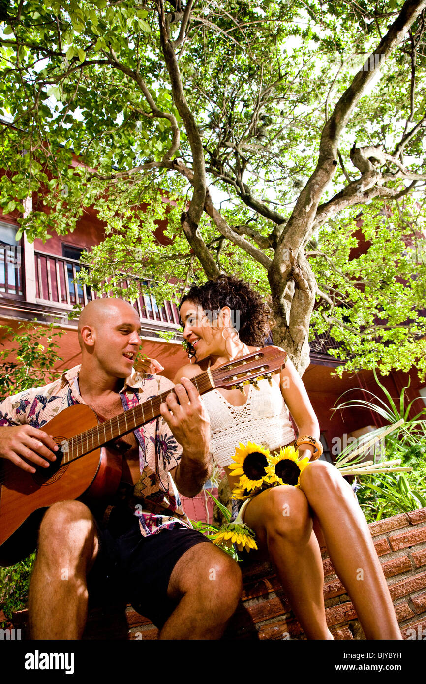 Couple having fun listening music hi-res stock photography and images ...
