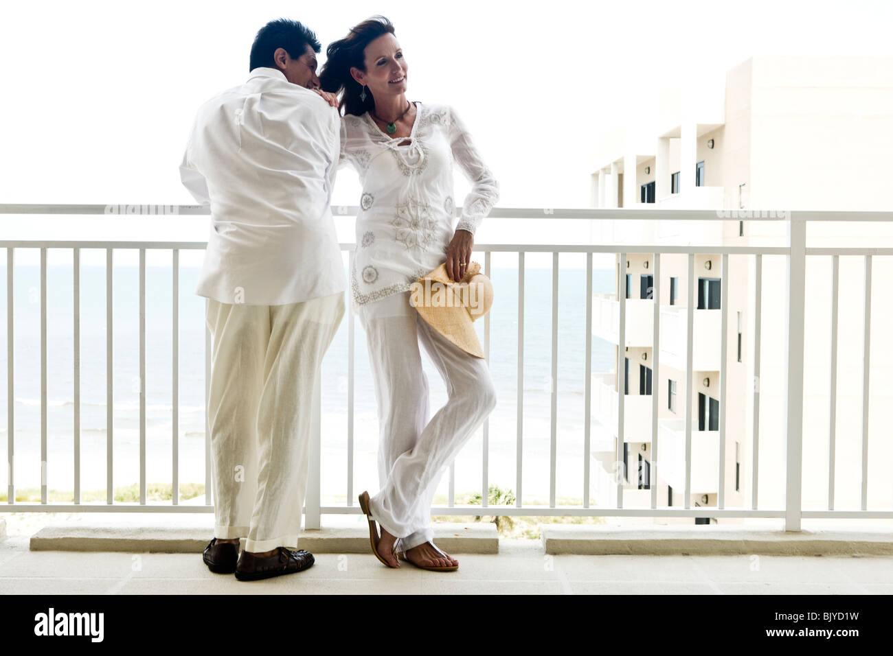 Two people on balcony behind hi-res stock photography and images - Alamy