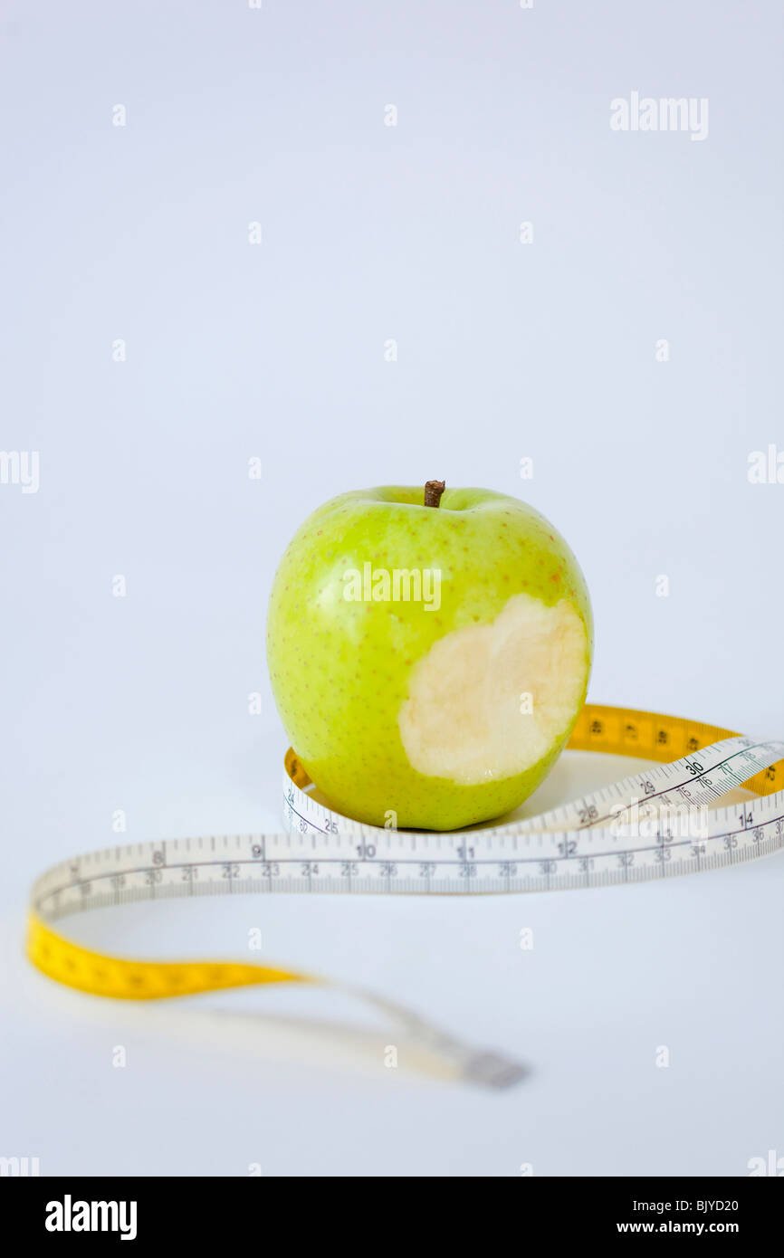 Tape measure and apple Stock Photo - Alamy
