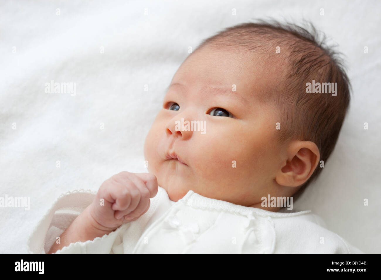 Newborn baby lying Stock Photo - Alamy