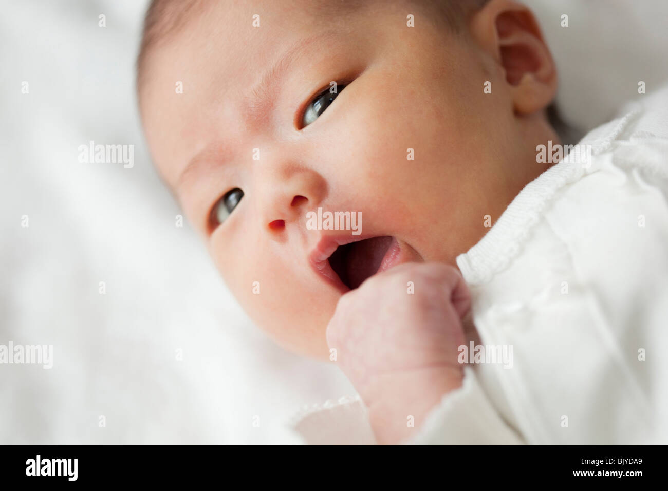 Newborn baby lying Stock Photo - Alamy
