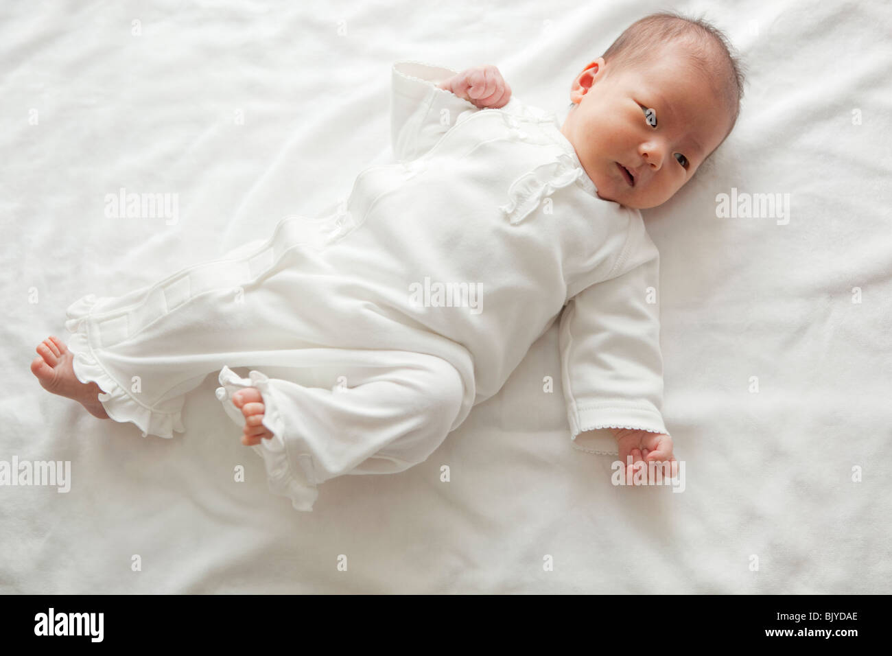 Newborn baby lying Stock Photo - Alamy