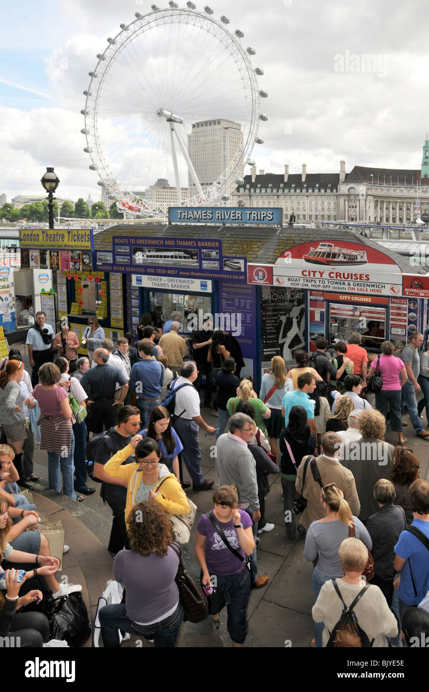 Tourists around ticket booths for River Thames tour boat trips from ...