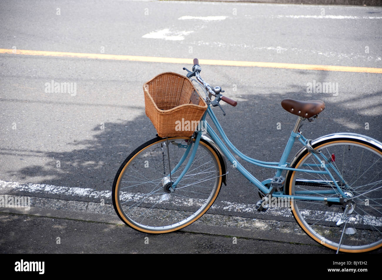 Blue bicycle on street Stock Photo - Alamy