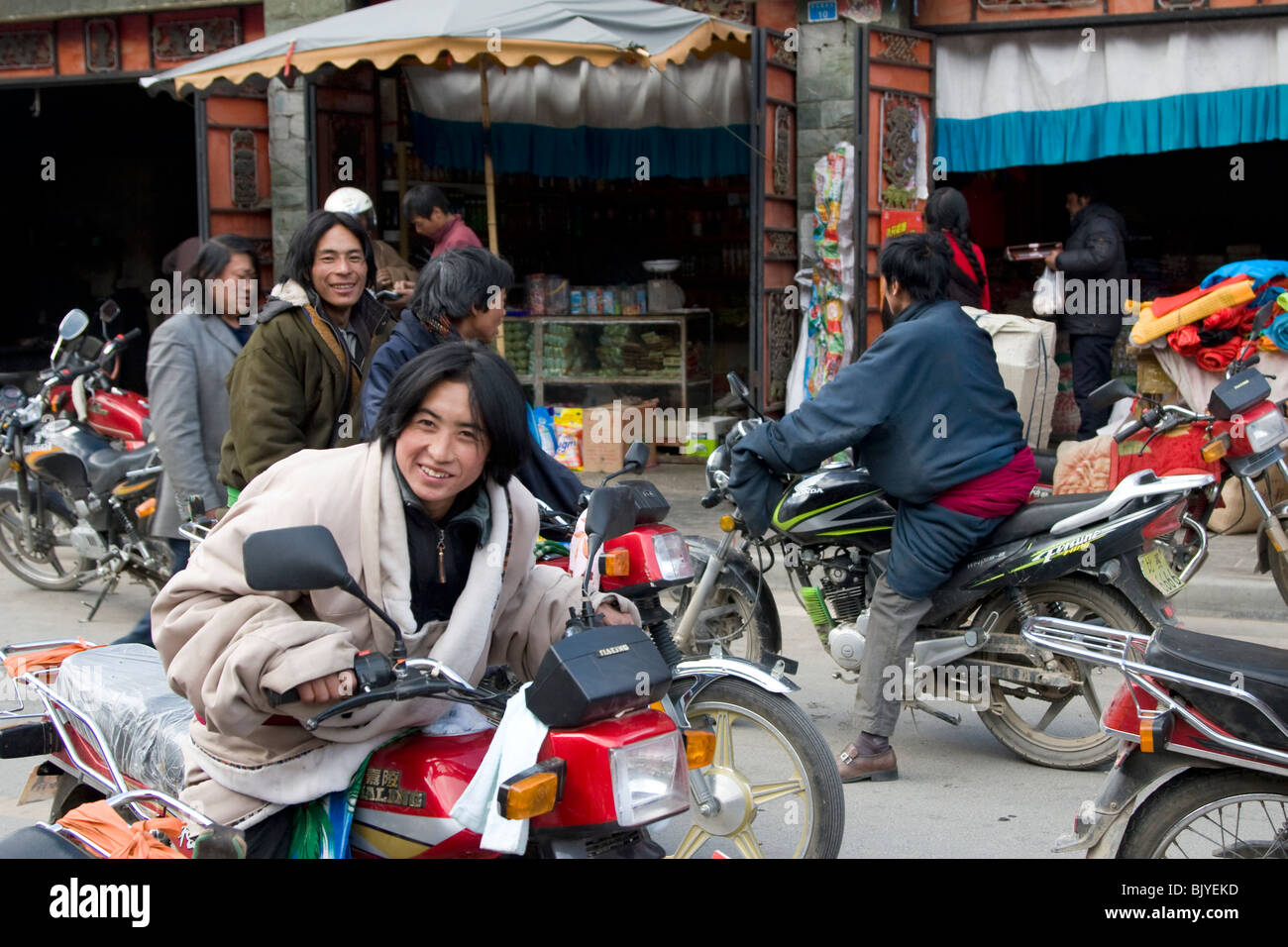 Tibetan men shopping at dusk from shops at Rangtang town (Zamtang in ...