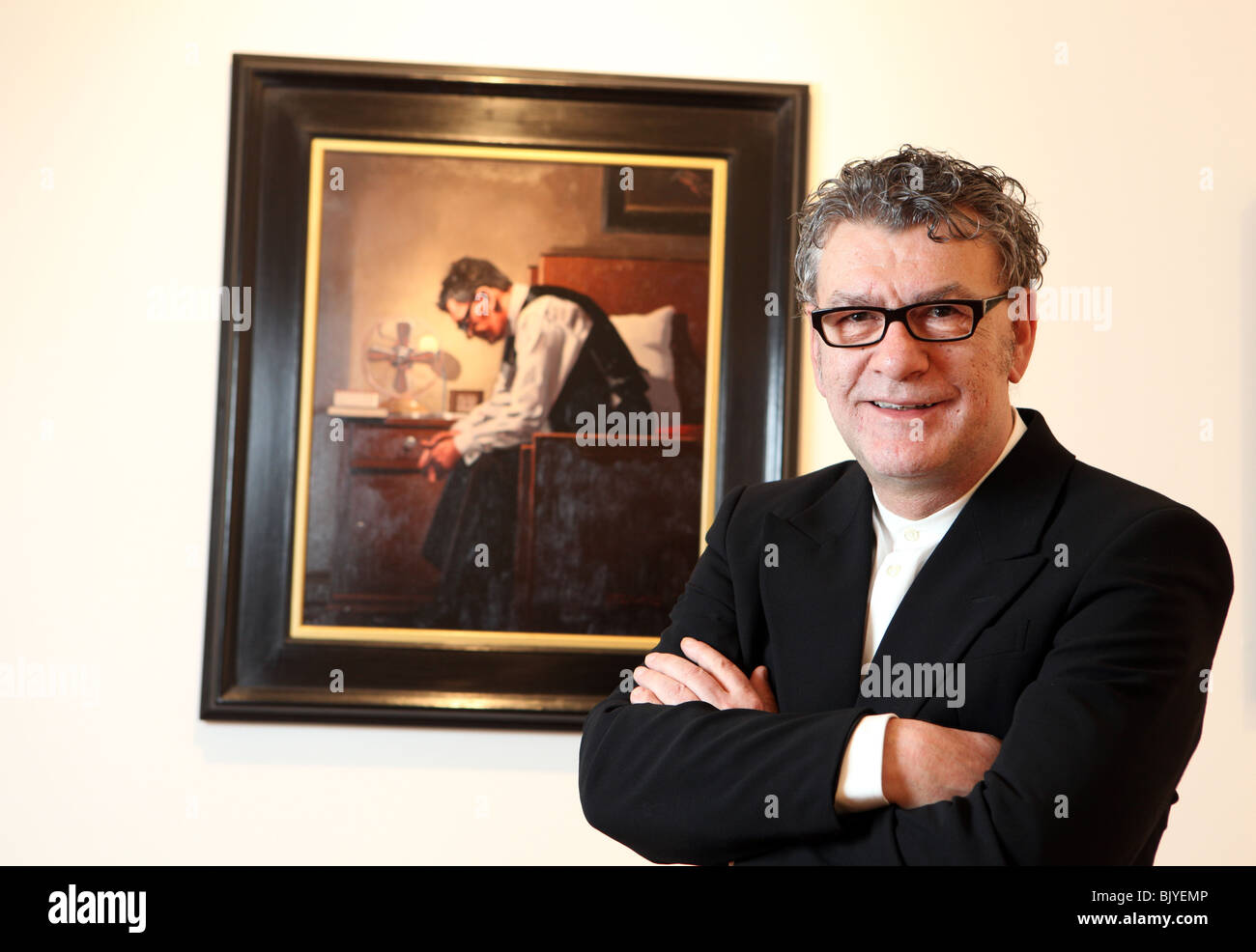 Scottish painter Jack Vettriano pictured with some of his work Stock ...