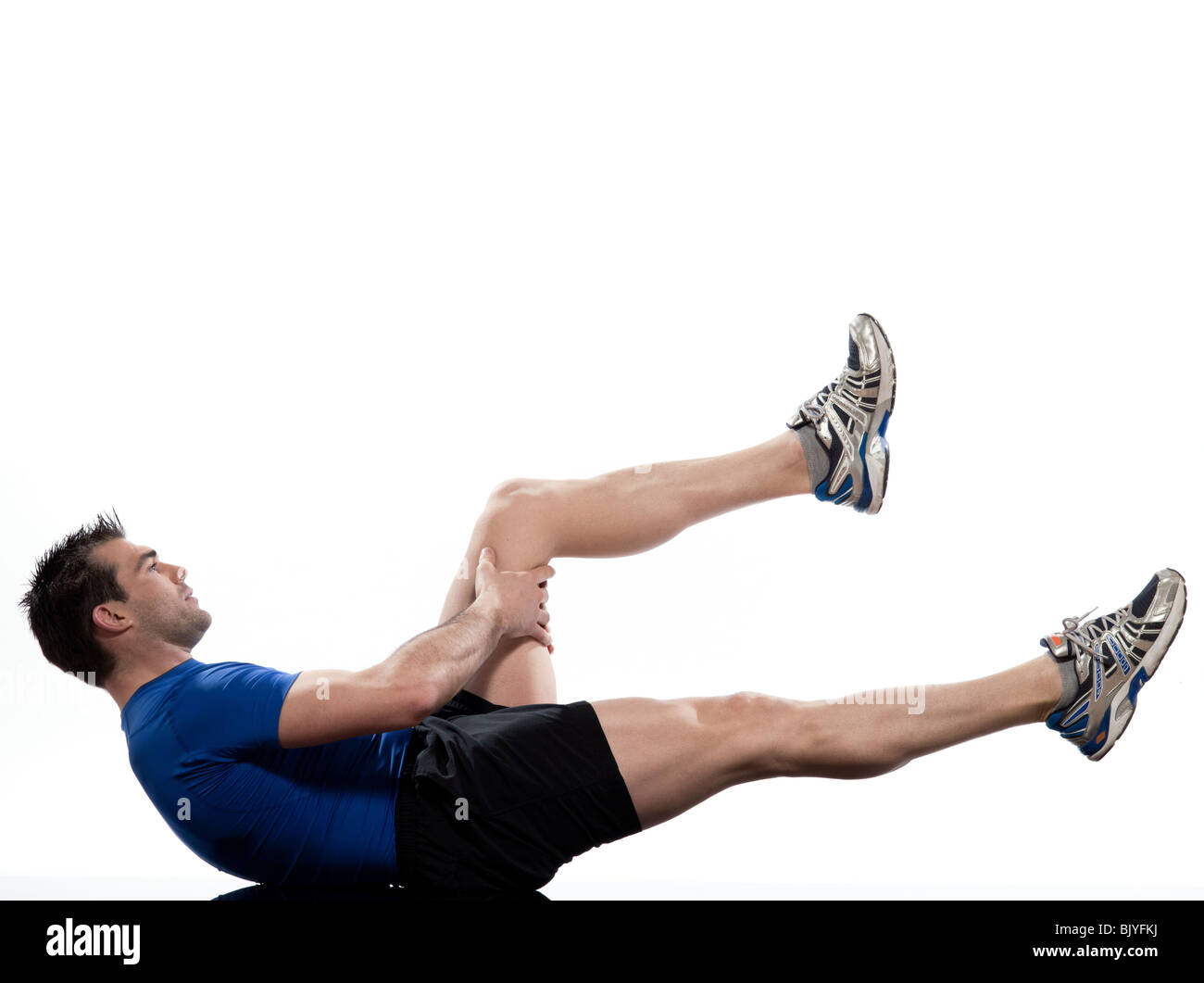 man on Abdominals workout posture on white background Stock Photo - Alamy