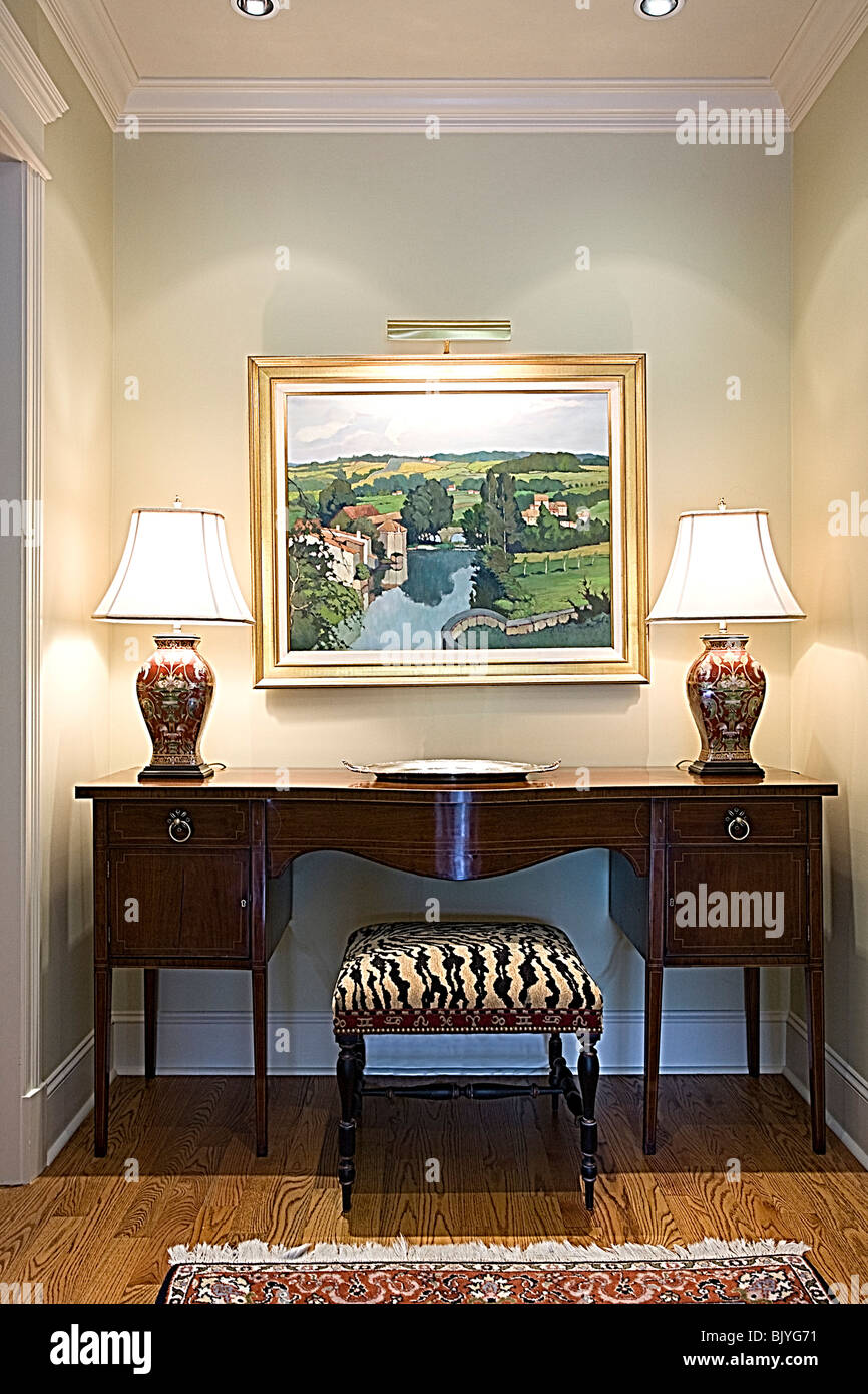 interior hallway of home with lights on and sitting bench Stock Photo ...