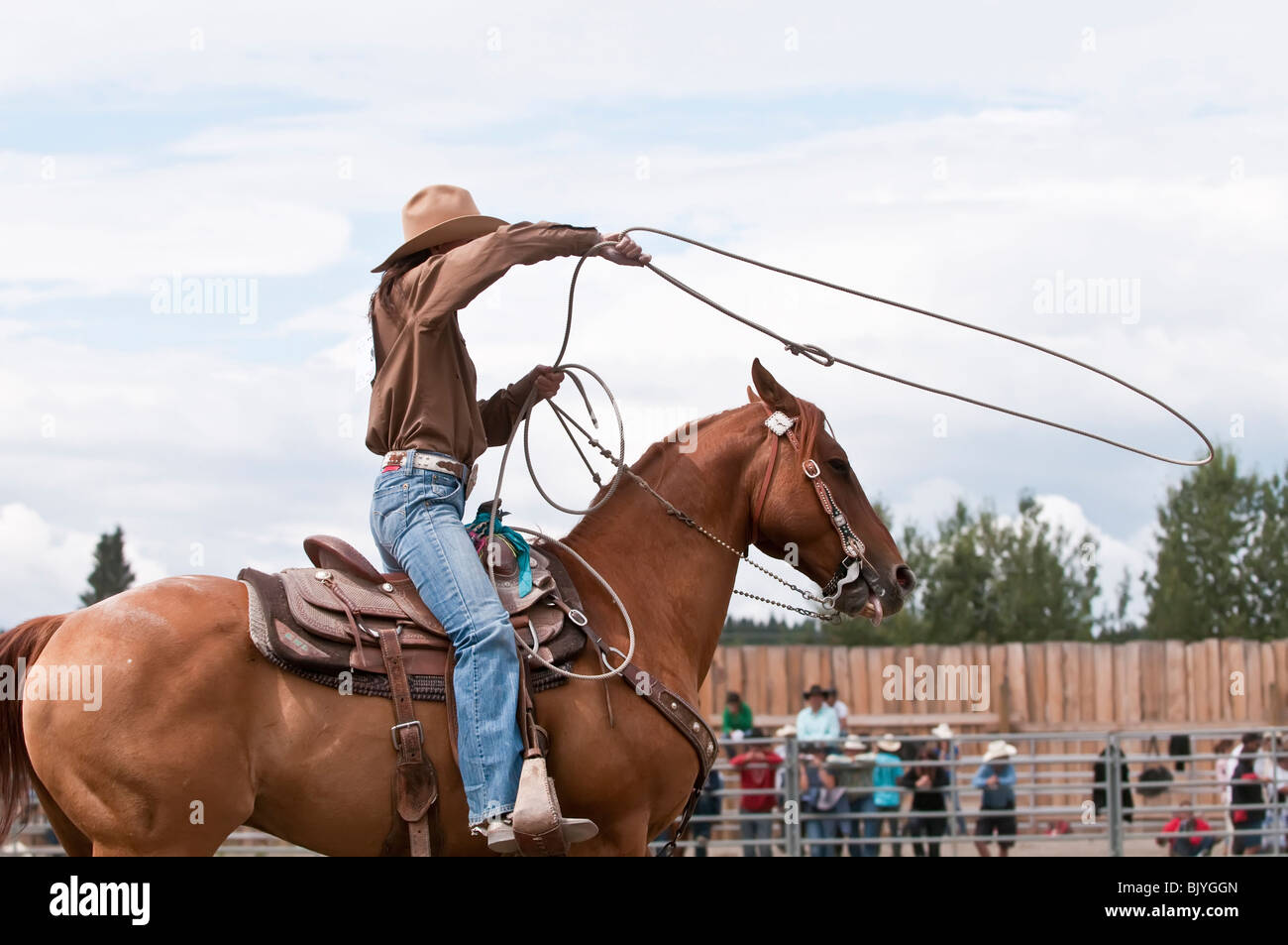 Cowgirl practicing with lasso, T'suu Tina rodeo, Bragg Creek, Alberta ...