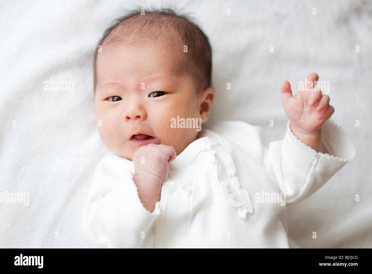 Newborn baby lying Stock Photo - Alamy