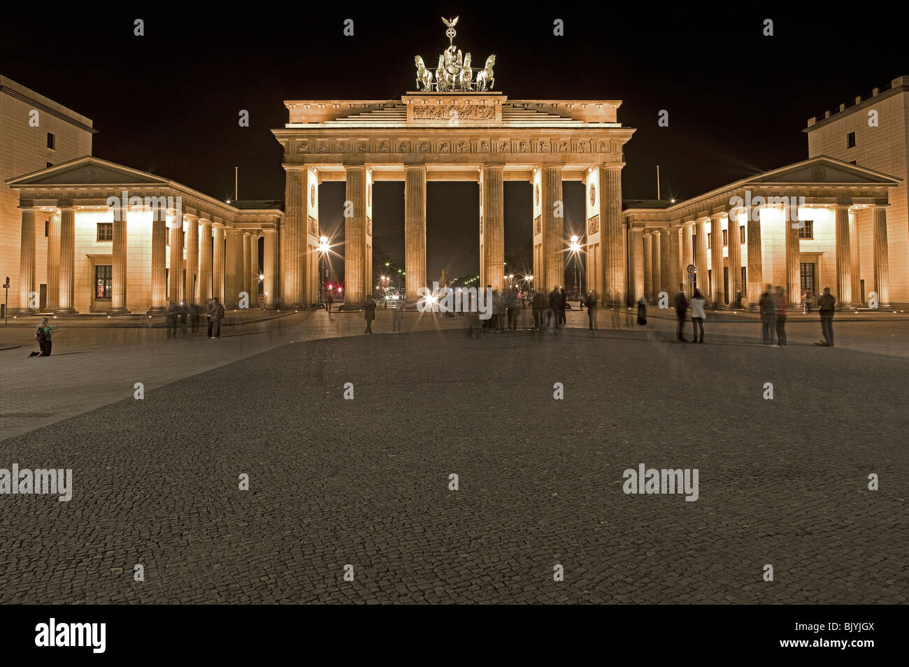 Tourists take pictures of the Brandenburg Gate in Berlin, Germany, on ...