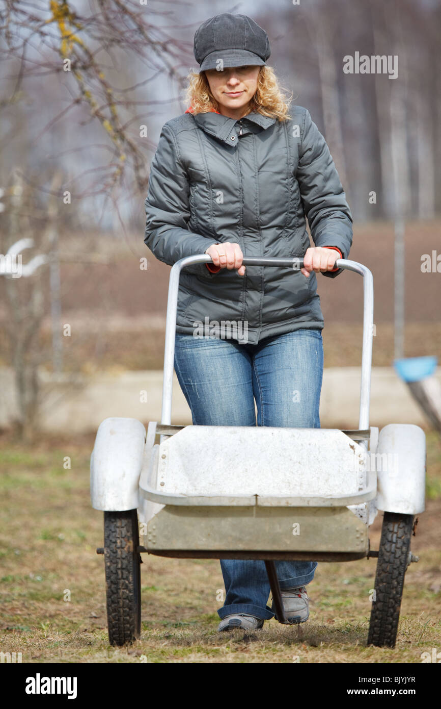 Person Pushing Wheel Barrow High Resolution Stock Photography and ...
