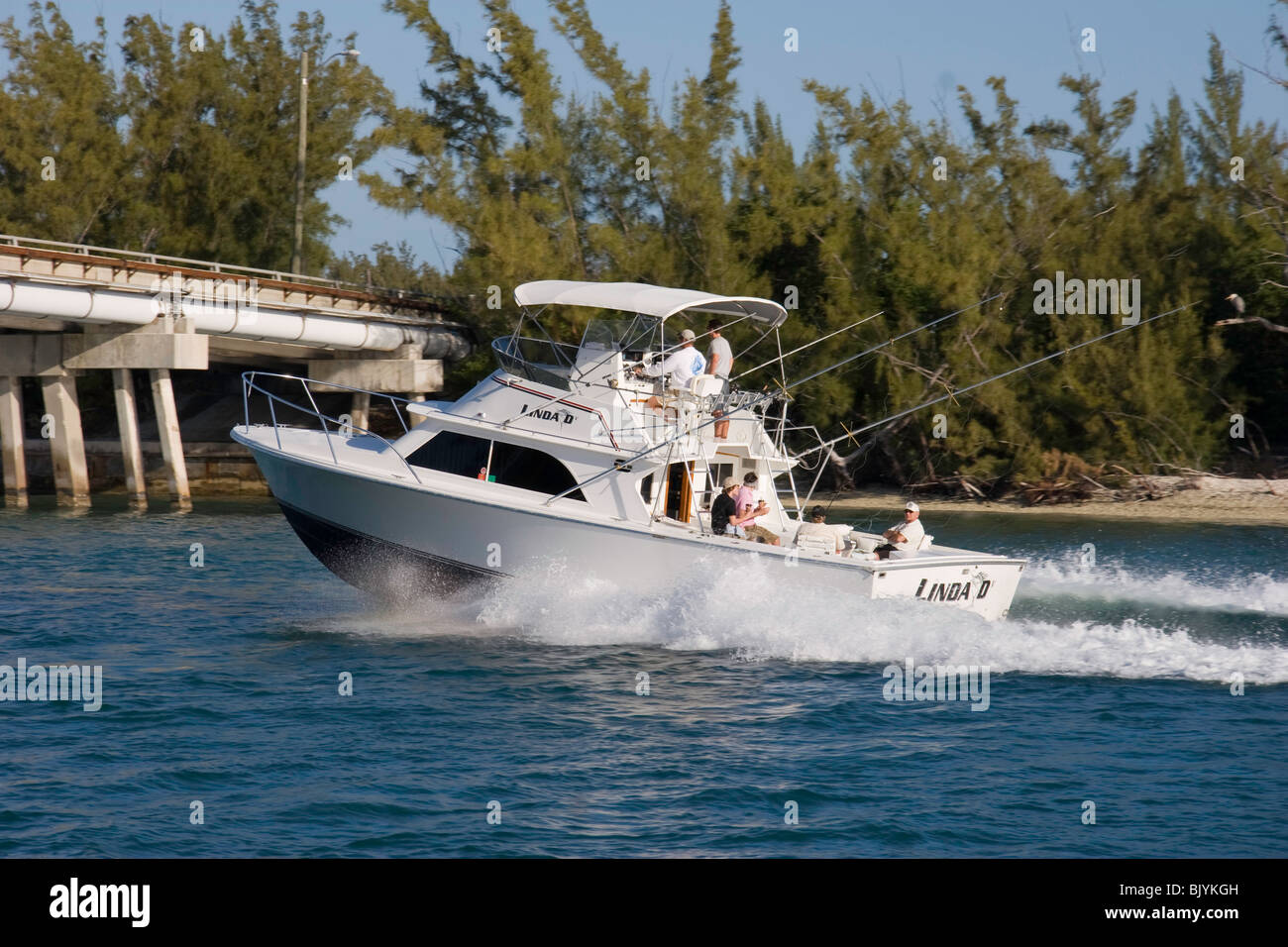 Outbound for a day of fishing Stock Photo - Alamy